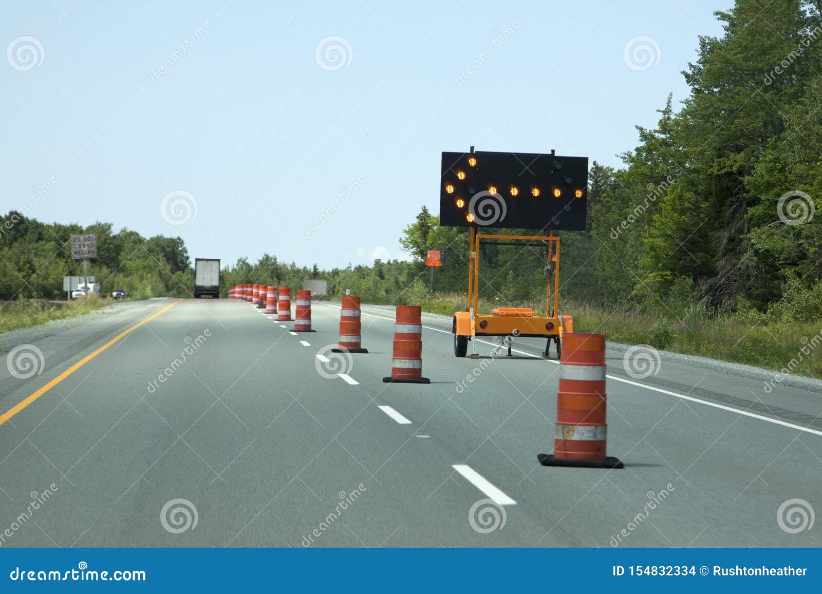 Construction Lit Arrow on the Highway Stock Photo - Image of cones ...