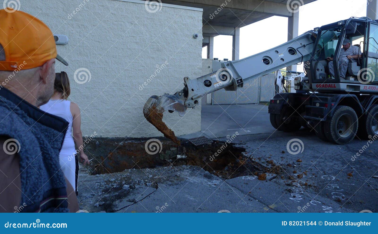 Construction Machine Digs Hole To Replace Old Pipes Editorial Stock ...
