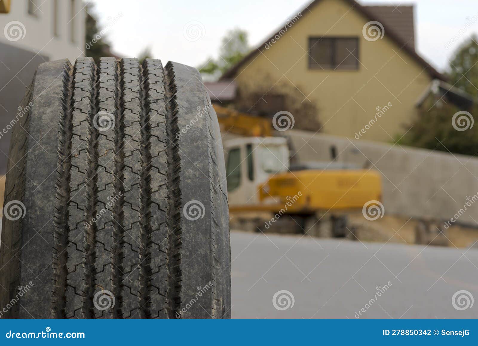 Construction Machine Wheel. in the Background a Construction Site and ...