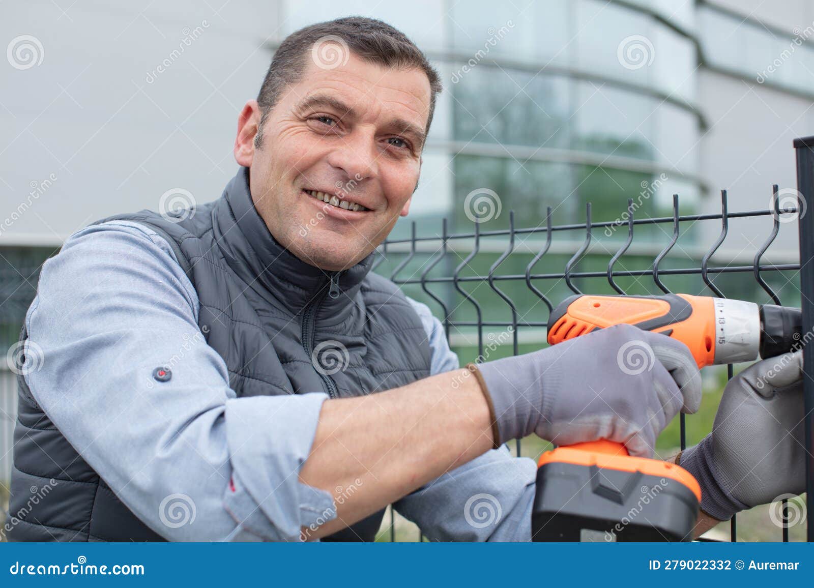 Construction Man Working with Cordless Electrical Screwdriver on Metal ...