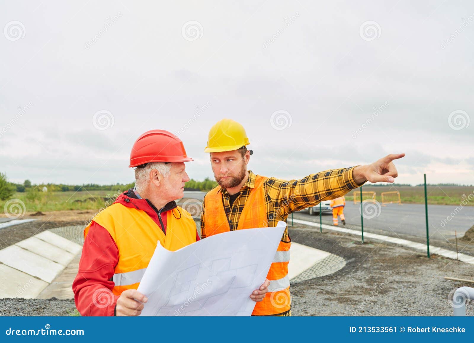 Construction Manager and Architect with Construction Drawing on ...