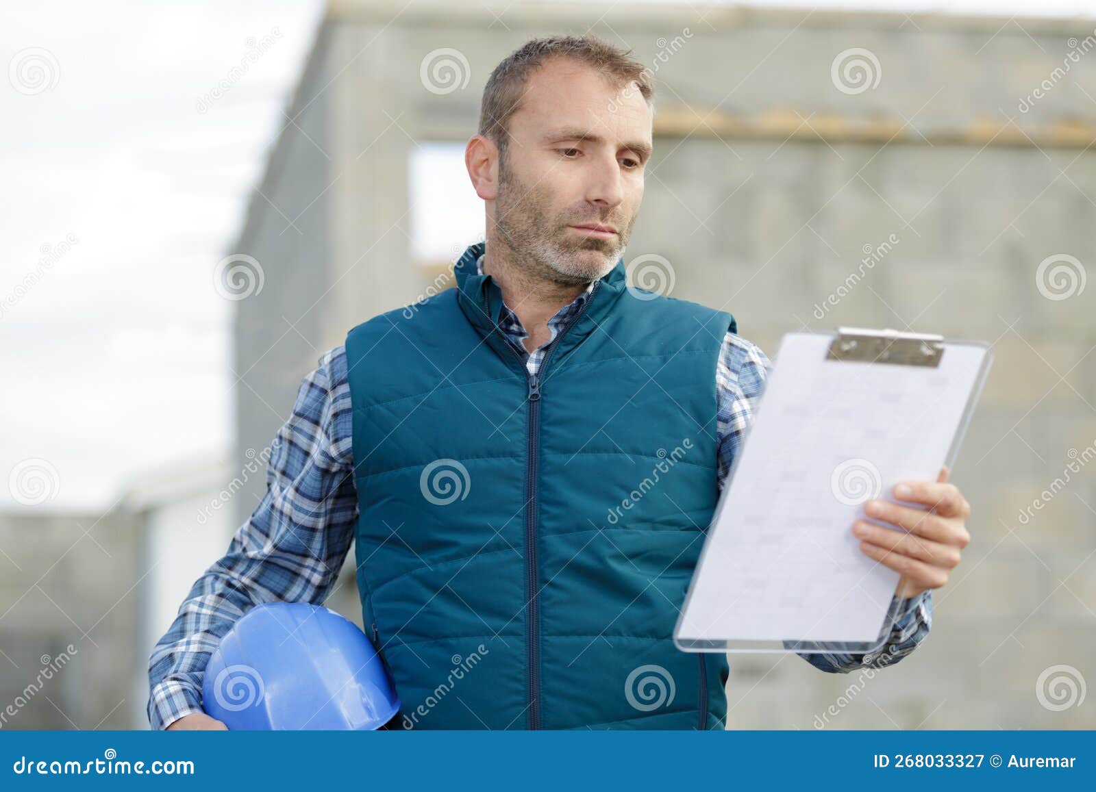 Construction Manager Checking Report at Construction Site Stock Image ...