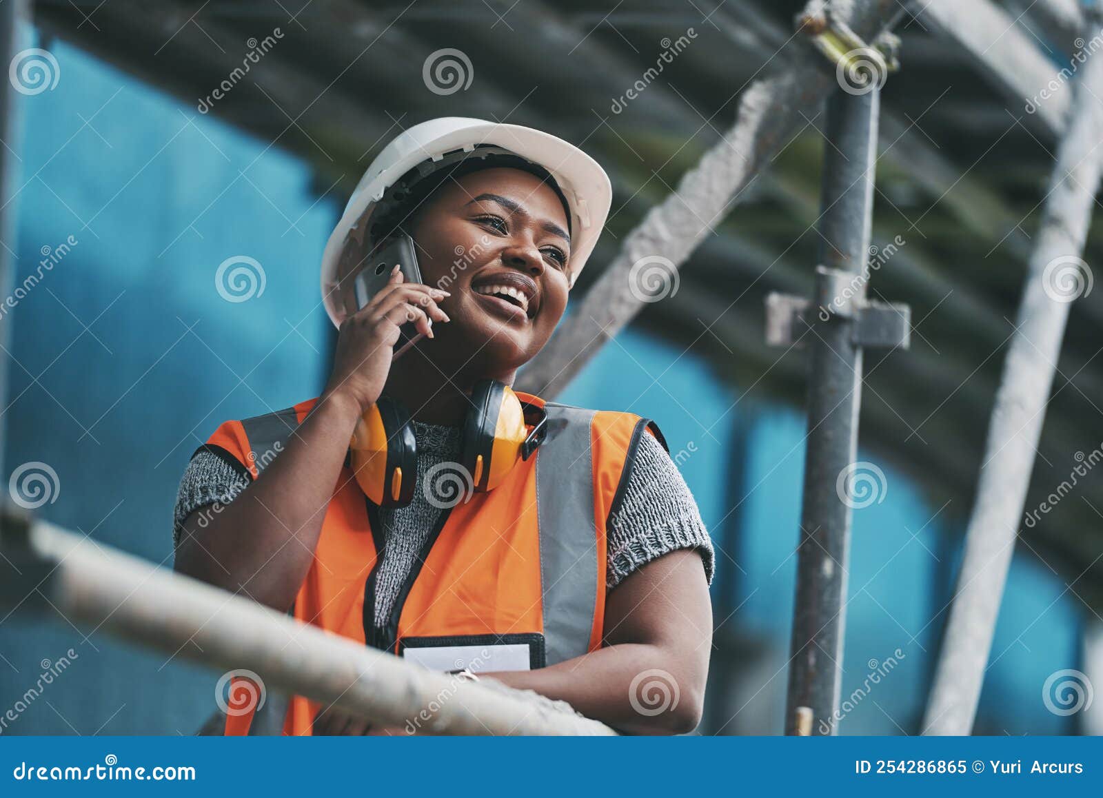 Construction Manager, Contractor and Engineer Talking on a Phone while ...