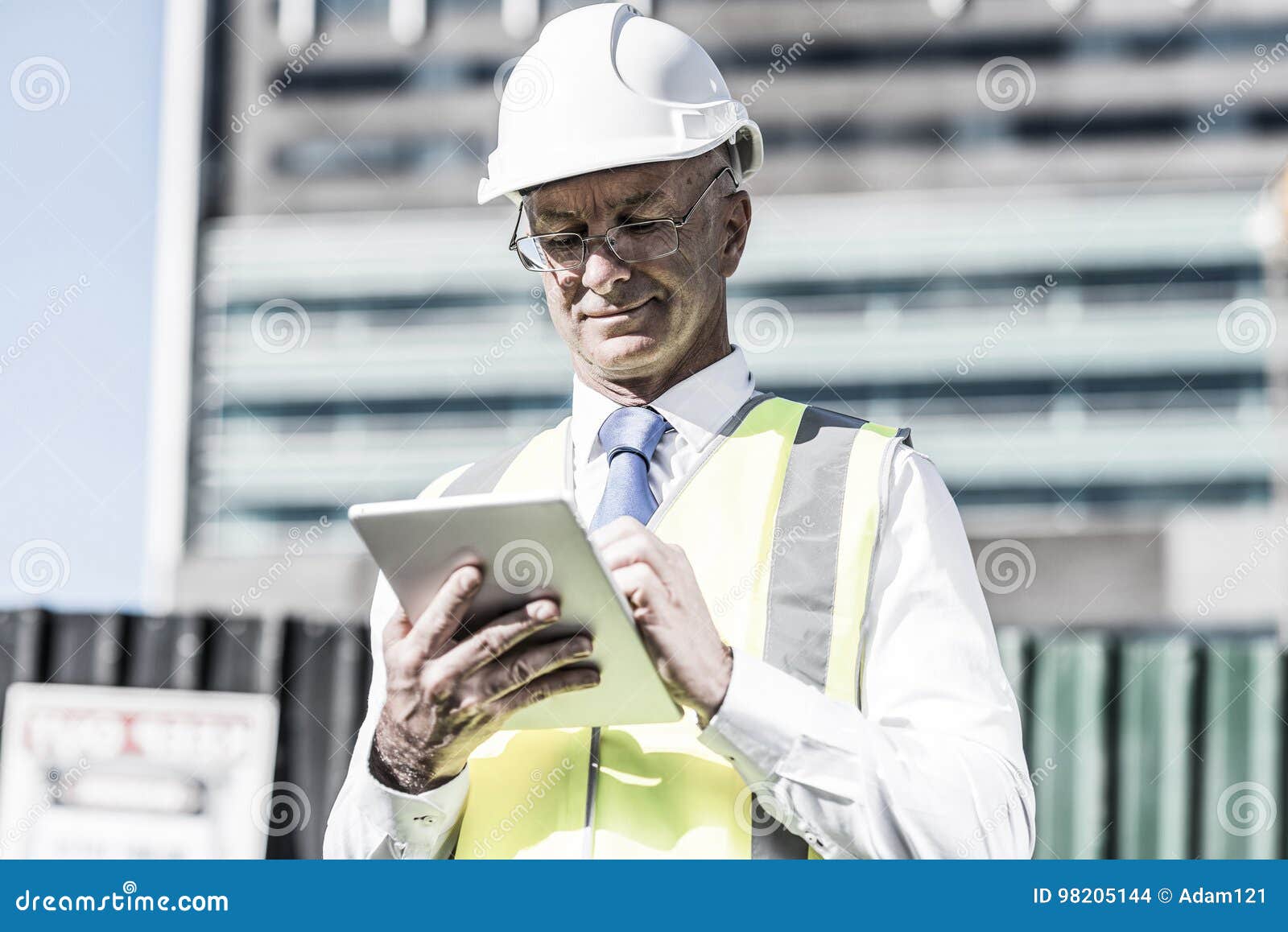 Construction Manager Controlling Building Site and Tablet Device Stock ...
