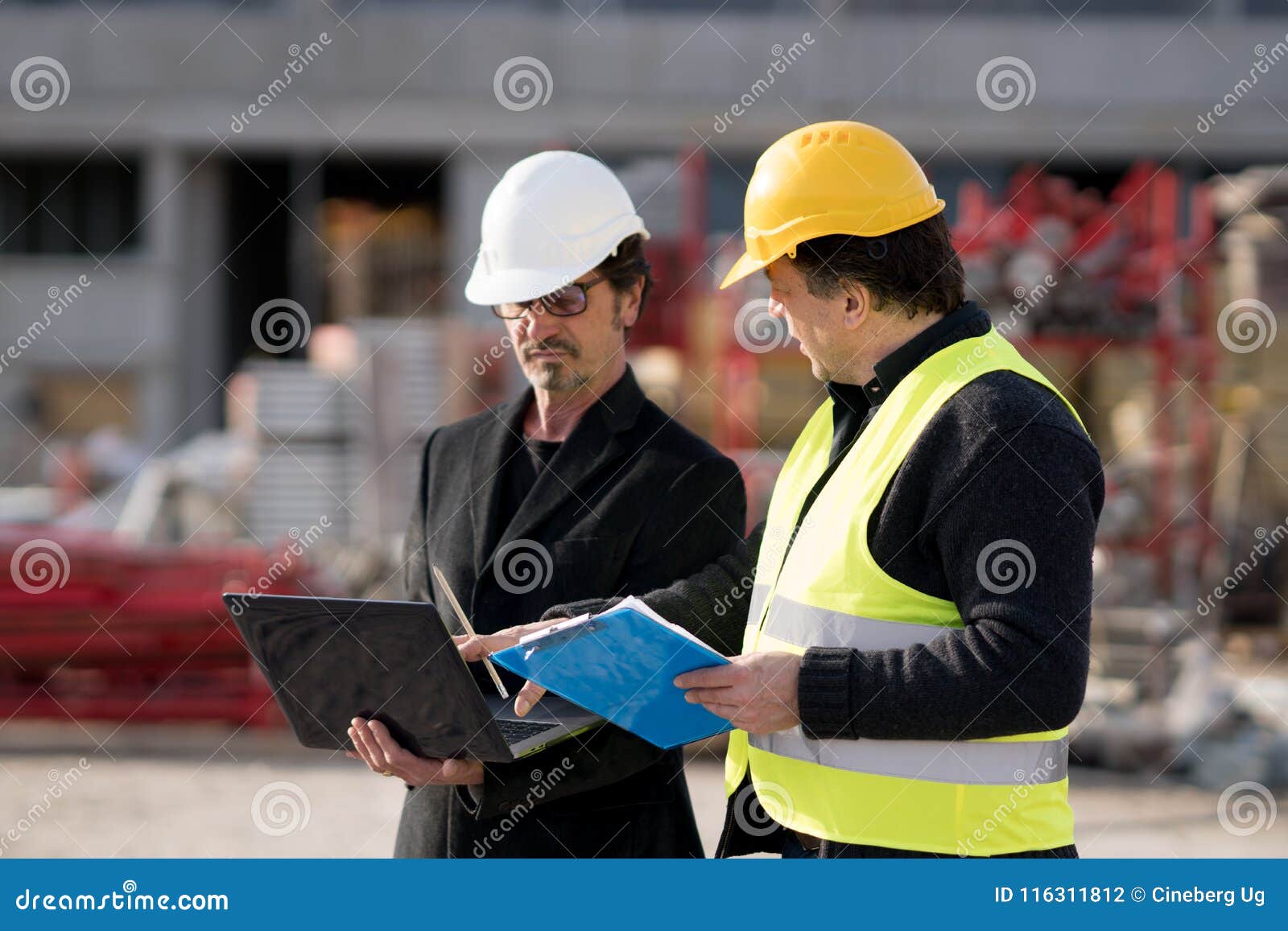 Construction Manager and Engineer at Work on Construction Site Stock ...