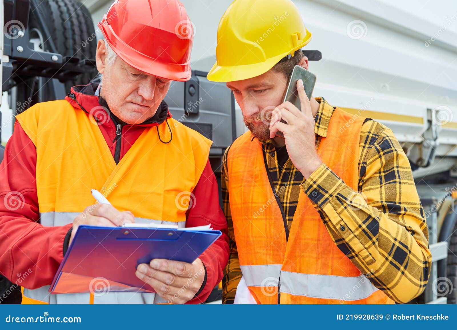 Construction Manager and Foreman with Checklist and Smartphone Stock ...