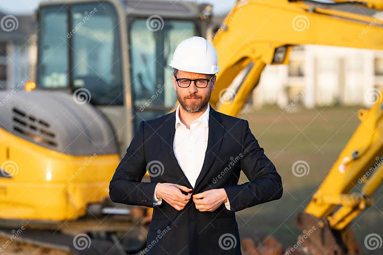 Construction Manager in Suit and Helmet at a Construction Site ...