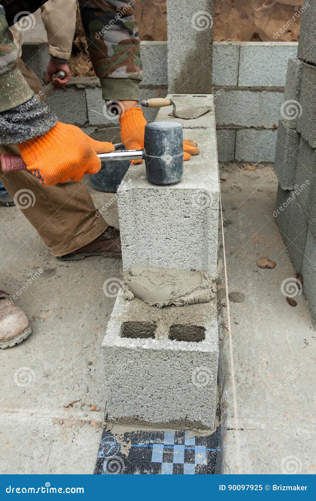 Construction Mason Worker Bricklayer Laying Concrete Block Foundation ...