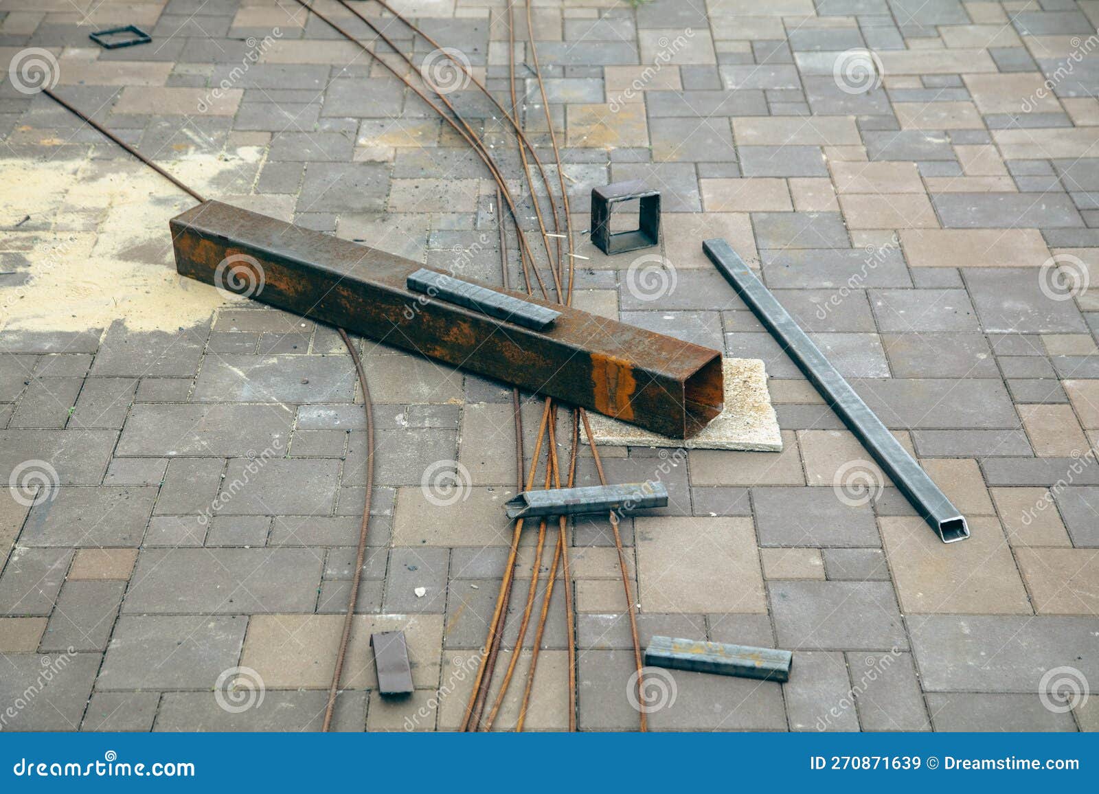 Construction Metal on Paving Slabs. Stock Image - Image of steel ...