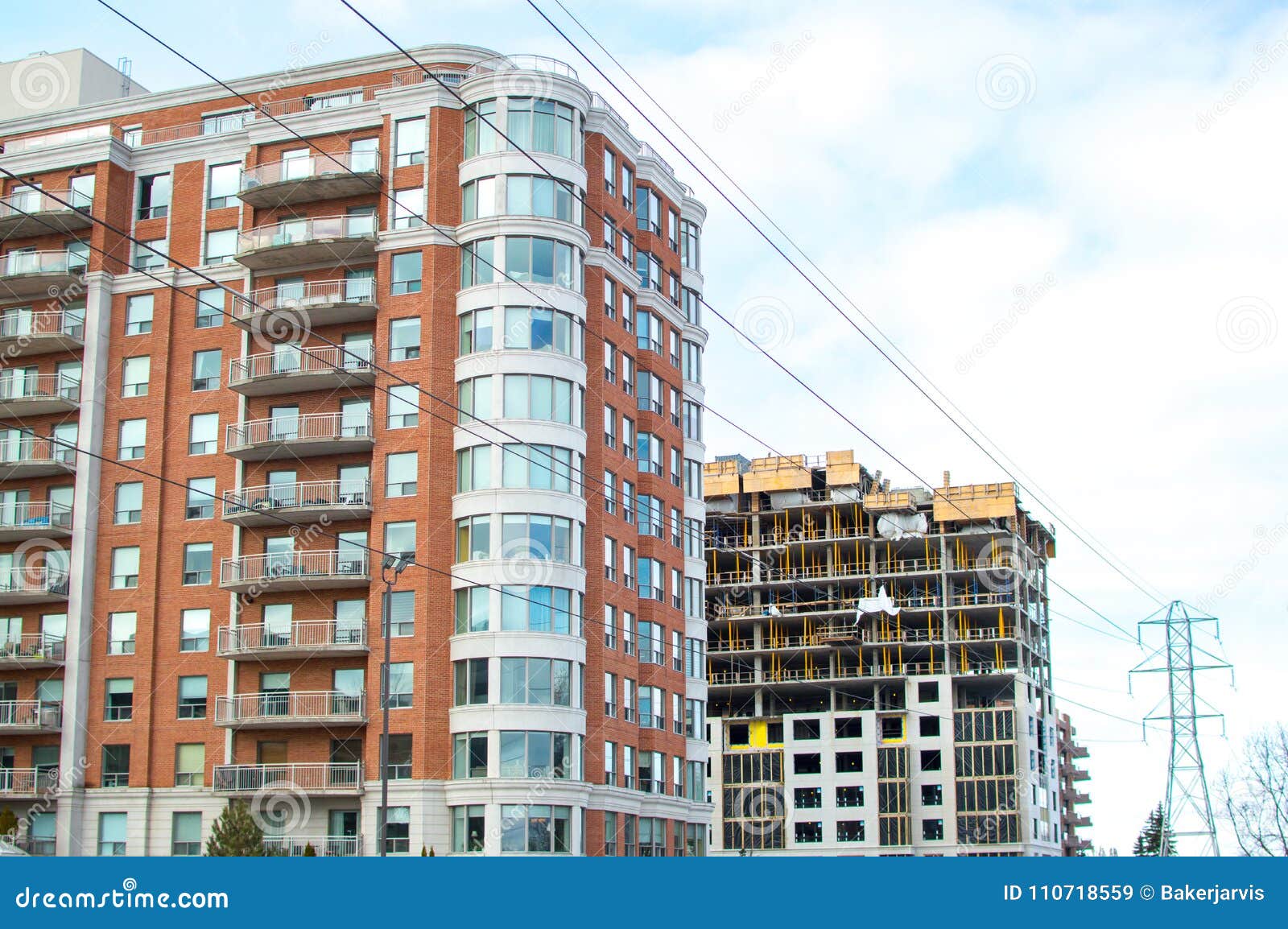 Construction and Modern Condo Buildings with Huge Windows and Balconies ...