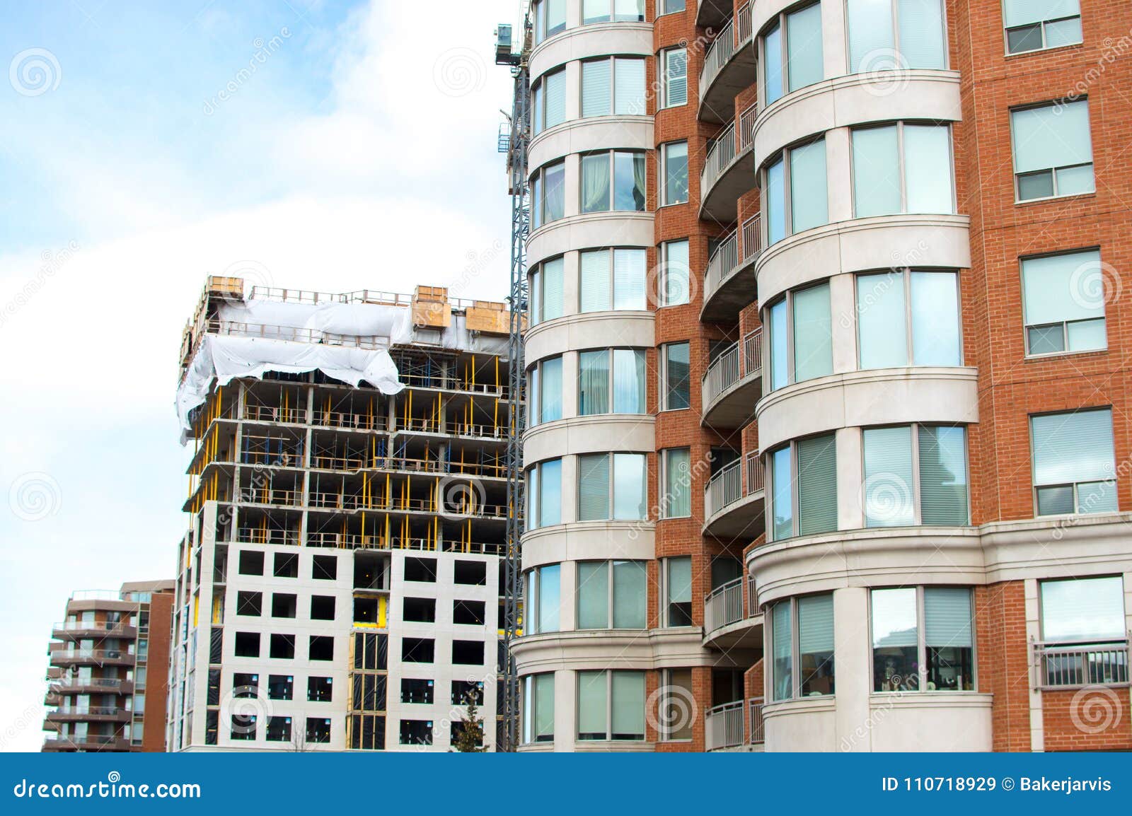 Construction and Modern Condo Buildings with Huge Windows and Balconies ...