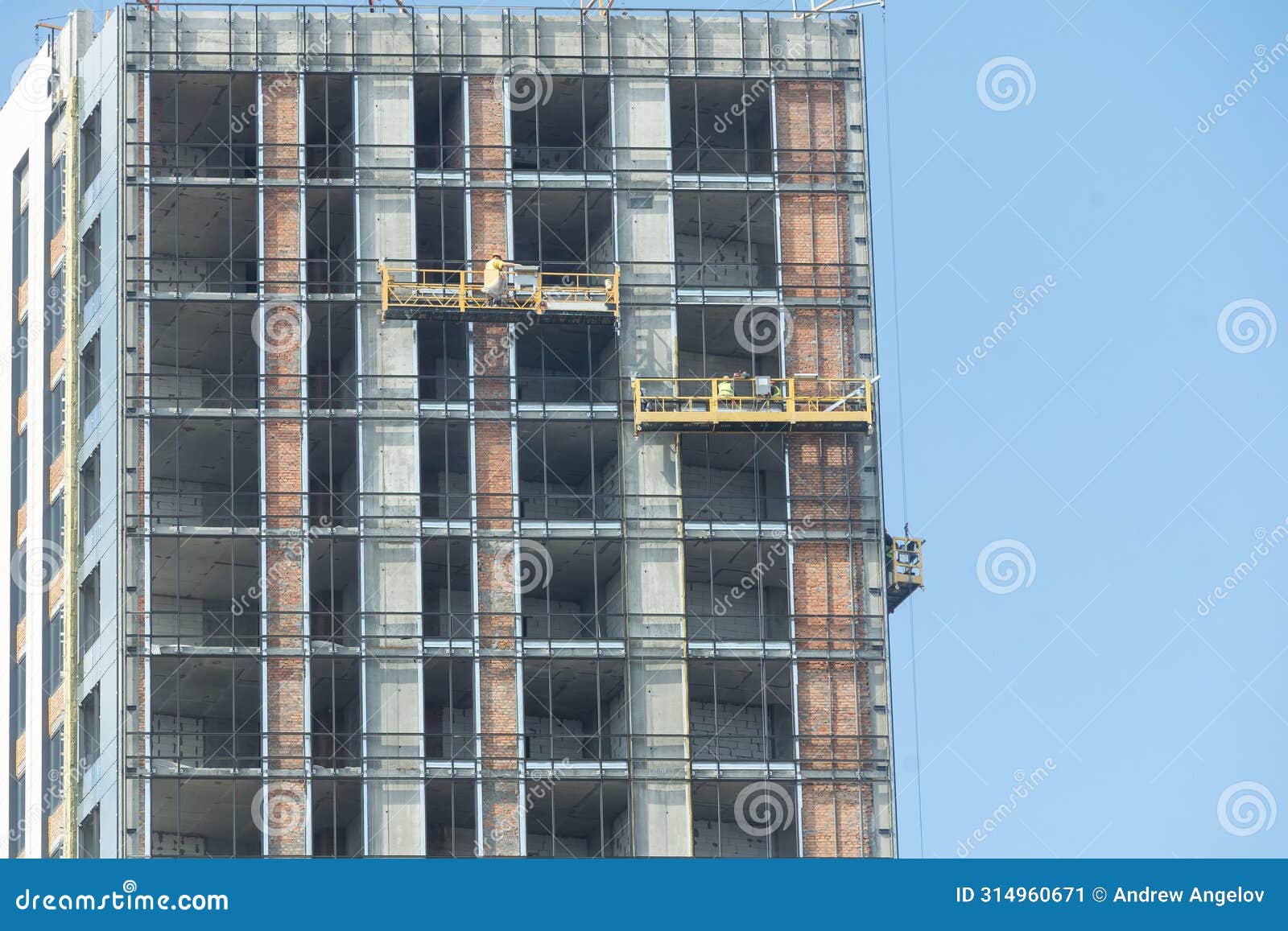 Construction of Modern Multi-storey Buildings. Workers in the ...