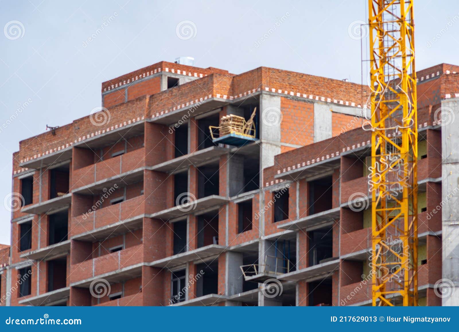 Construction of a Monolithic Apartment Building Lined with Red Bricks ...