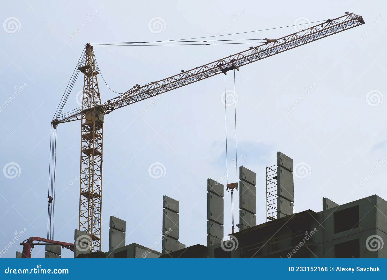 Construction of a Multi-storey Residential Building. Tower Crane at a ...