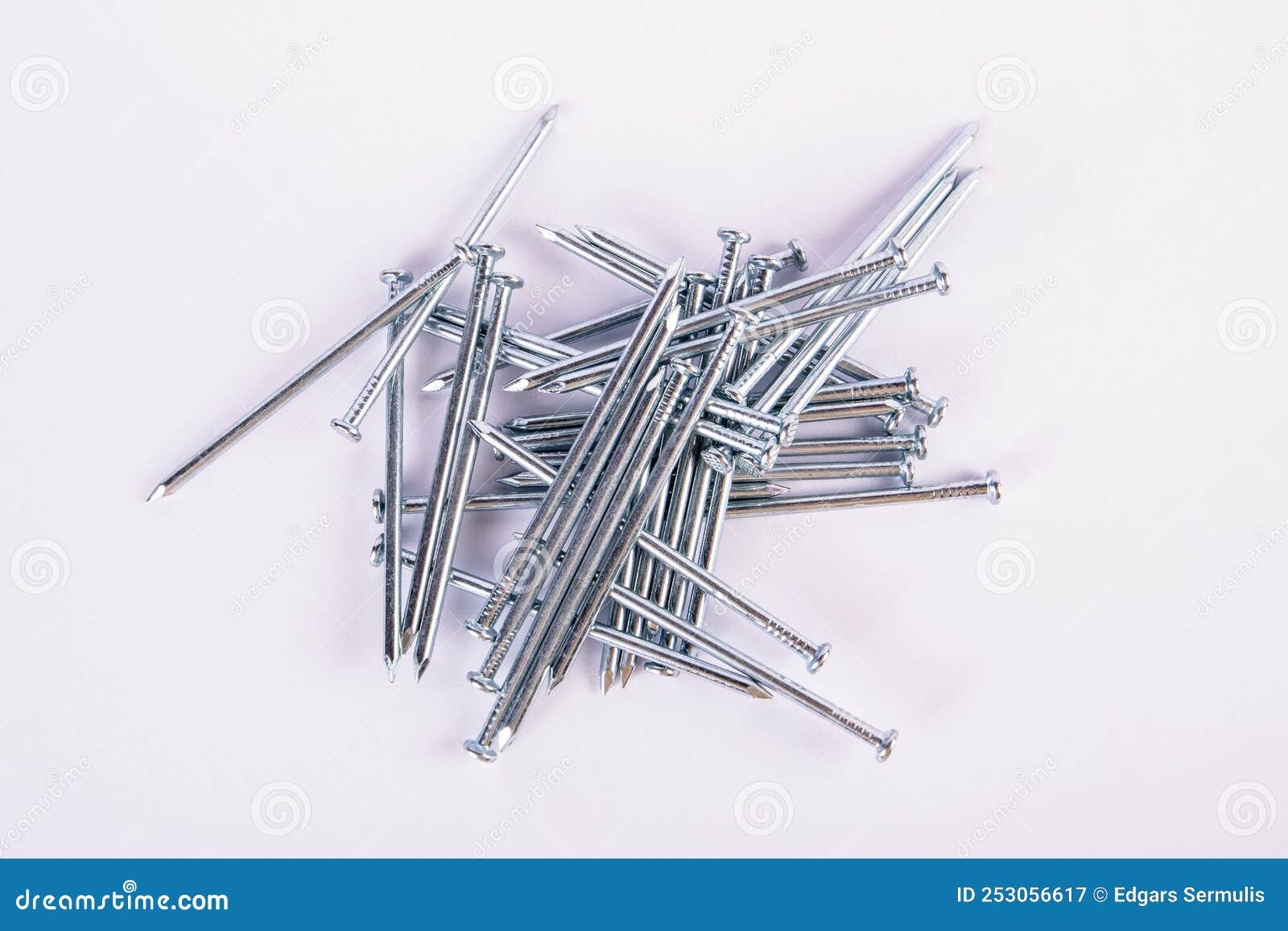 Construction Nails Lie Stripe On A White Background. Steel Nails Are ...