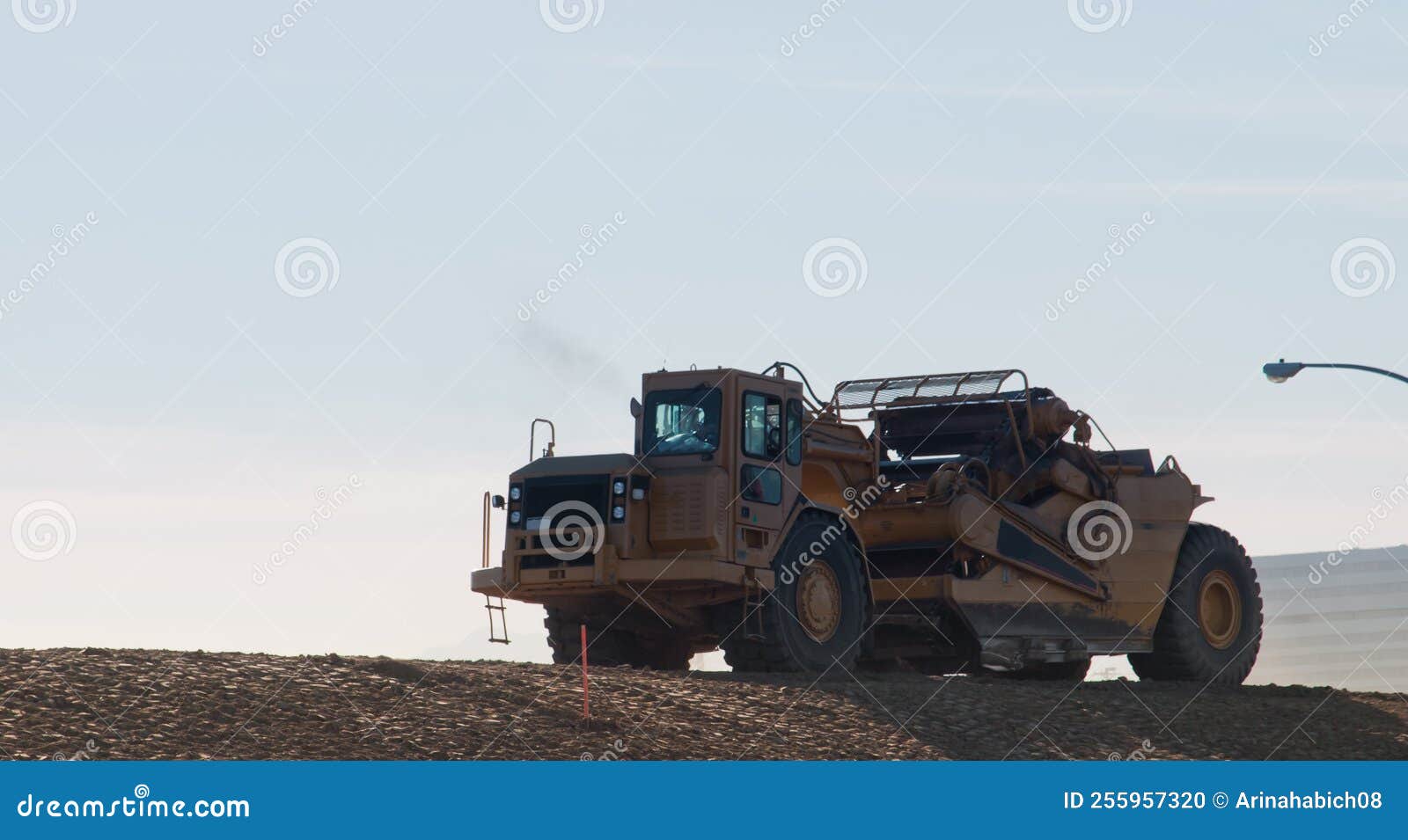 Wheel tractor-scraper stock photo. Image of development - 255957320