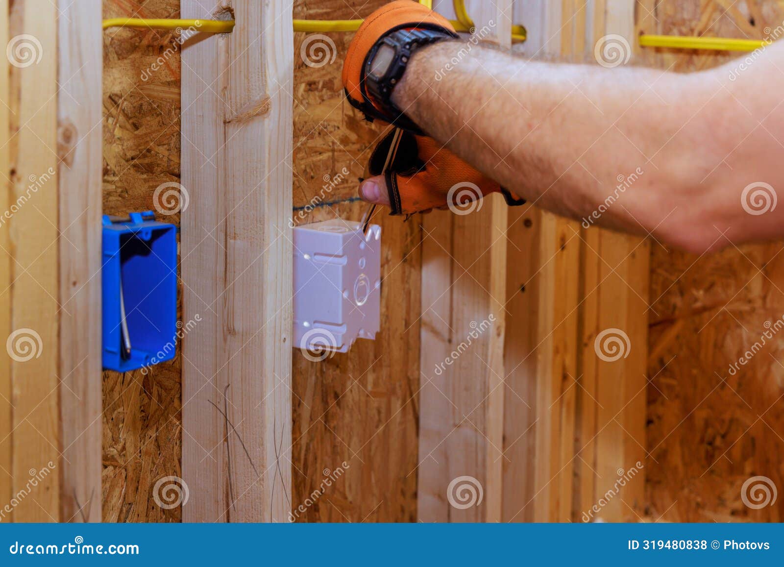 During Construction of a New Building, an Electrician Connects Wires To ...