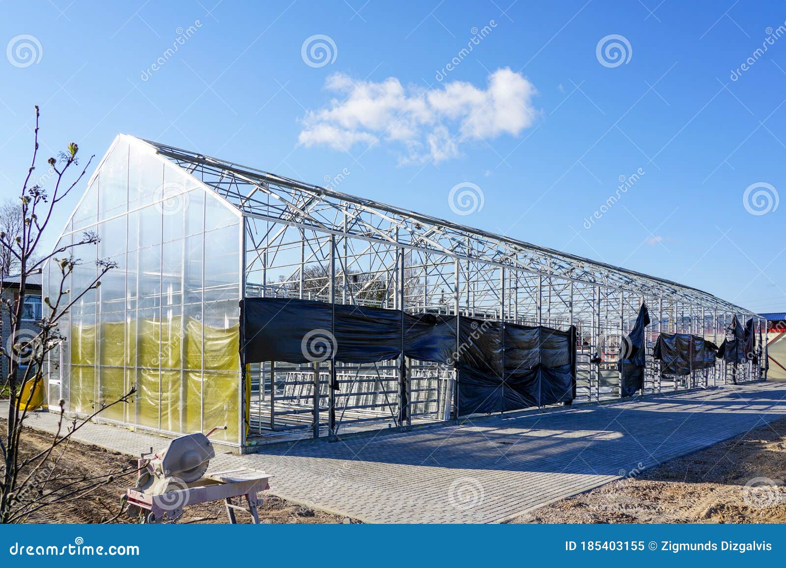 Construction of a New Large Greenhouse with a Metal Frame in a Rural ...