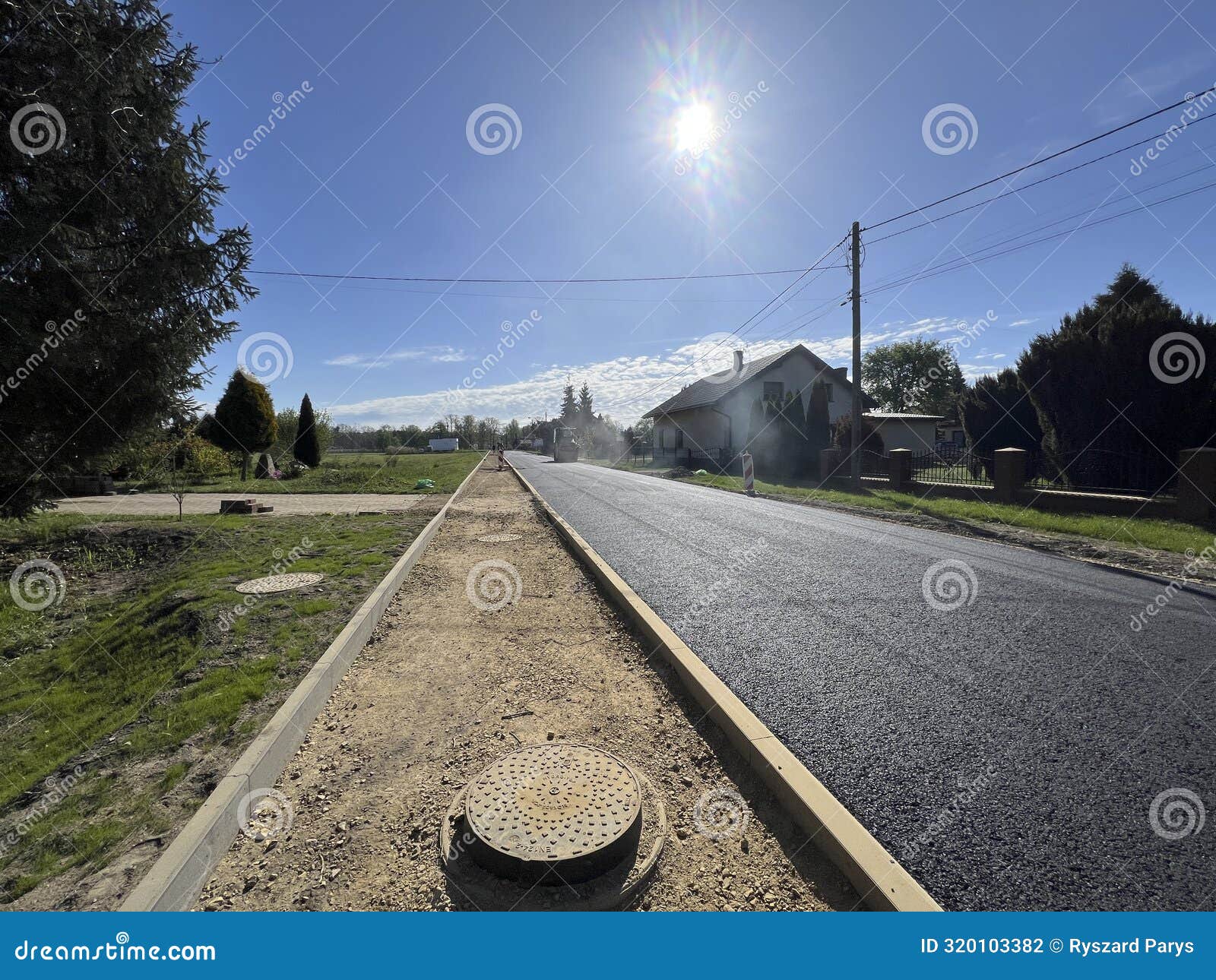Construction of a New Street Surface. Laying a Layer of Asphalt with a ...