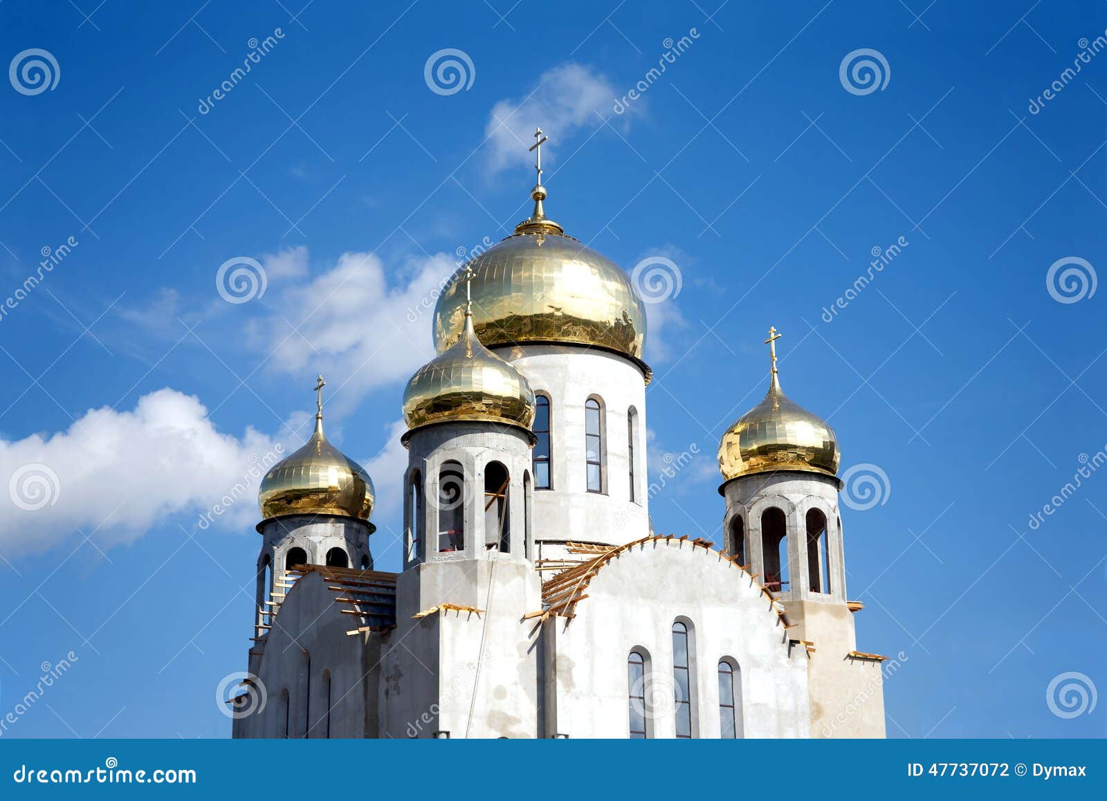 Construction of a New Temple with Gold Domes Against Blue Sky Stock ...
