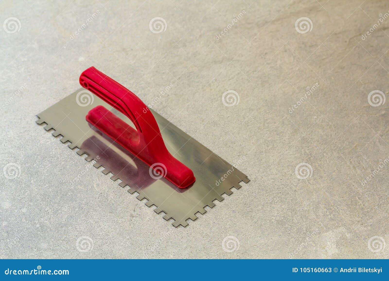 Construction Notched Trowel is a Tool for Tiles Installation Work Stock ...