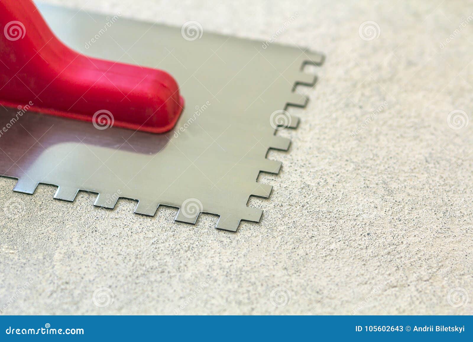Construction Notched Trowel is a Tool for Tiles Installation Work Stock ...
