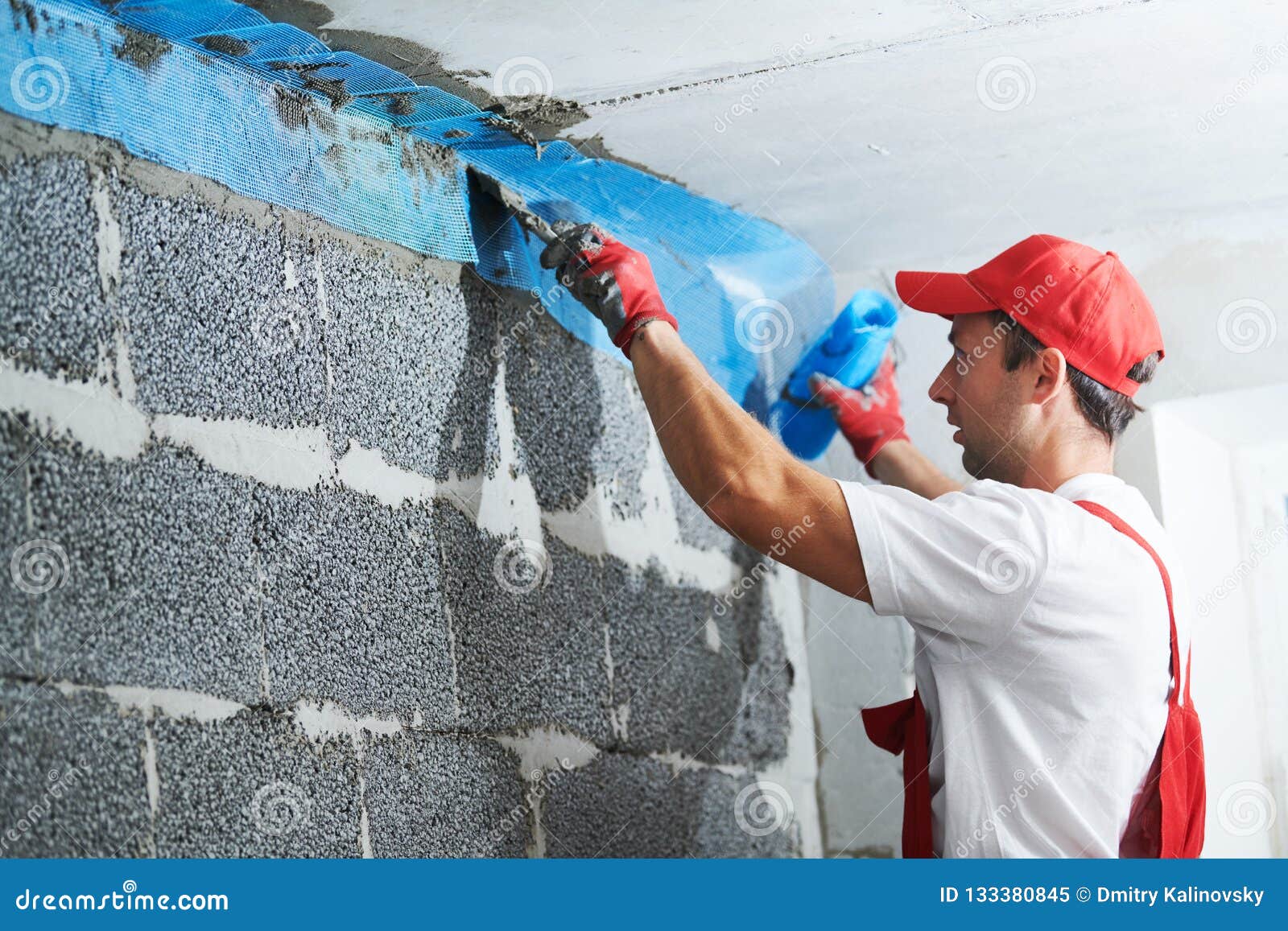 Plasterer Worker Protecting Corner with Mesh. Building Technology Stock ...