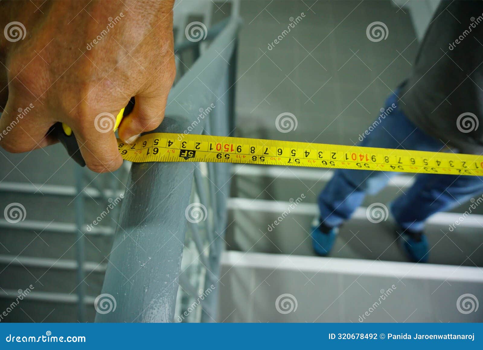 Construction Process - Hand Measuring the Weight of Stair Rail Stock ...