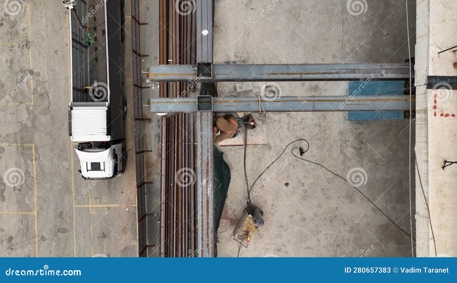 Construction Progress: Aerial View of Workers Welding Iron Structures ...