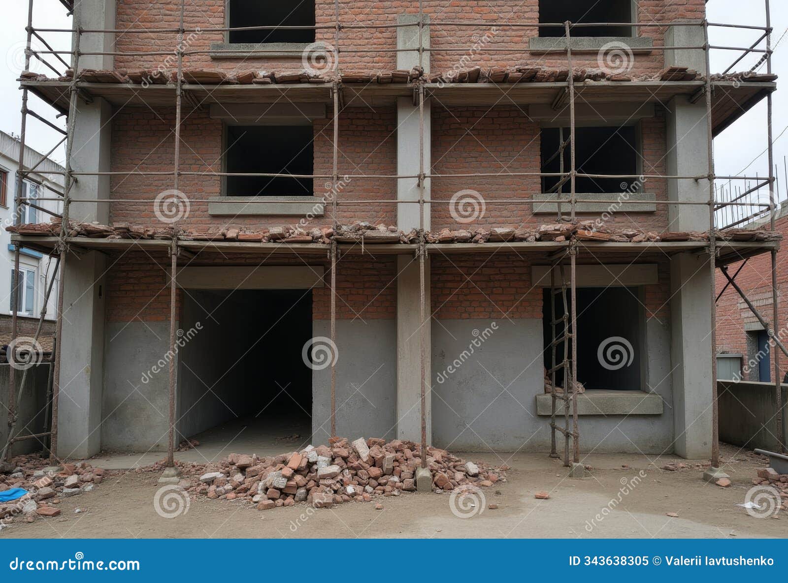 Construction Progress of a Three-story Building with Scaffolding and ...