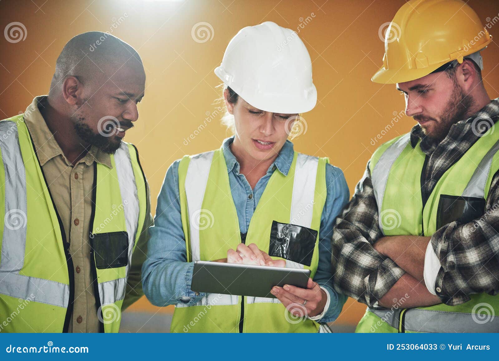 Construction Projects Gone Paperless. a Group of Builders Using a ...
