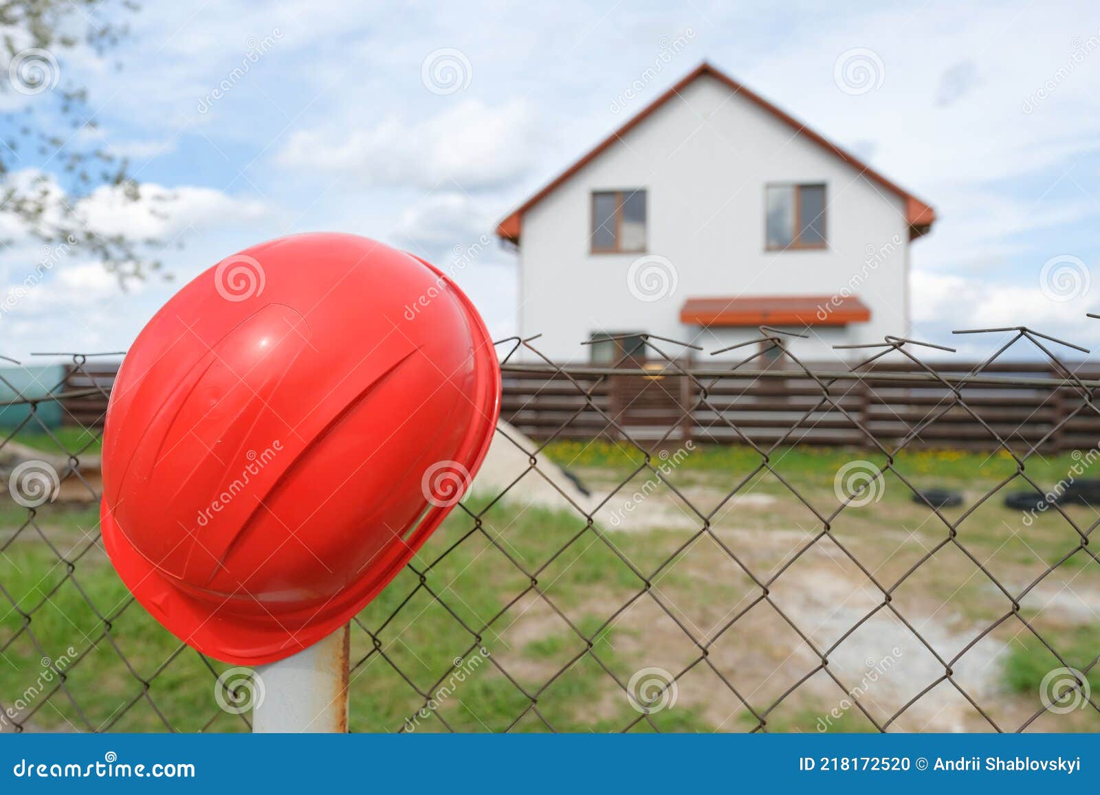Construction Red Helmet on the Background of the House. Cottage Town ...