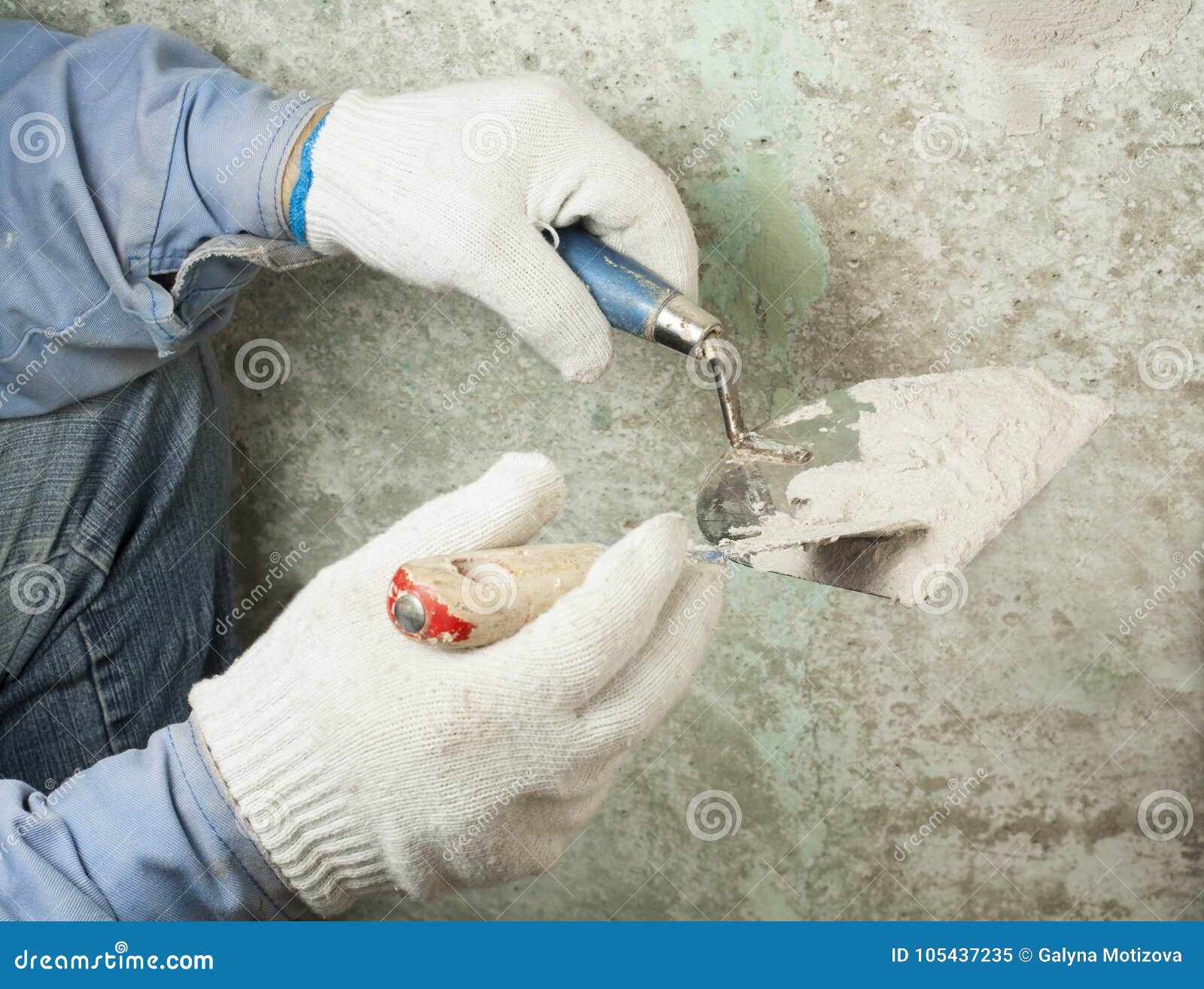 Construction and Renovation Concept. Hands of Worker in Gloves with ...