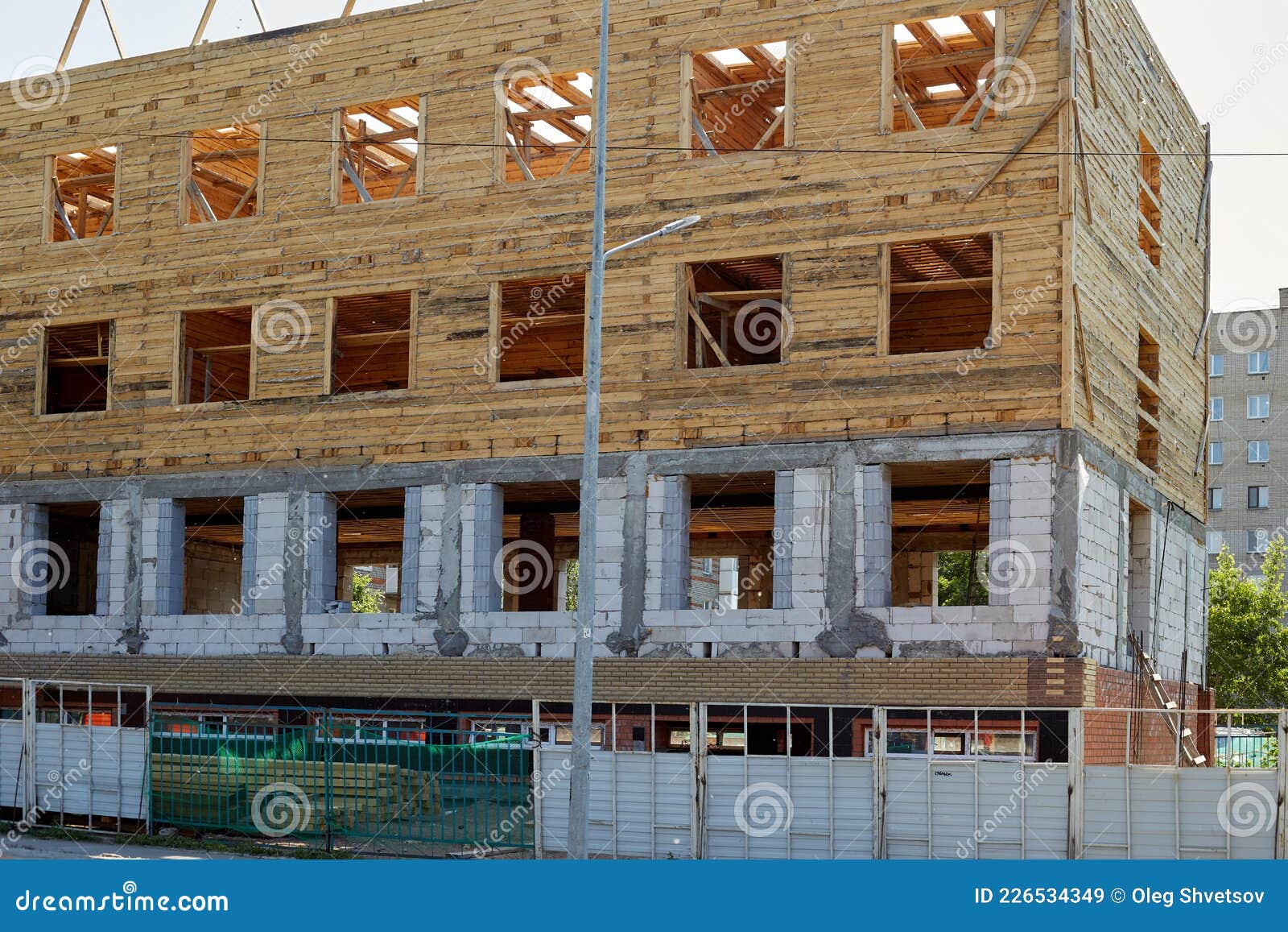 Construction of a Residential Building Made of Bricks and Wooden Logs ...