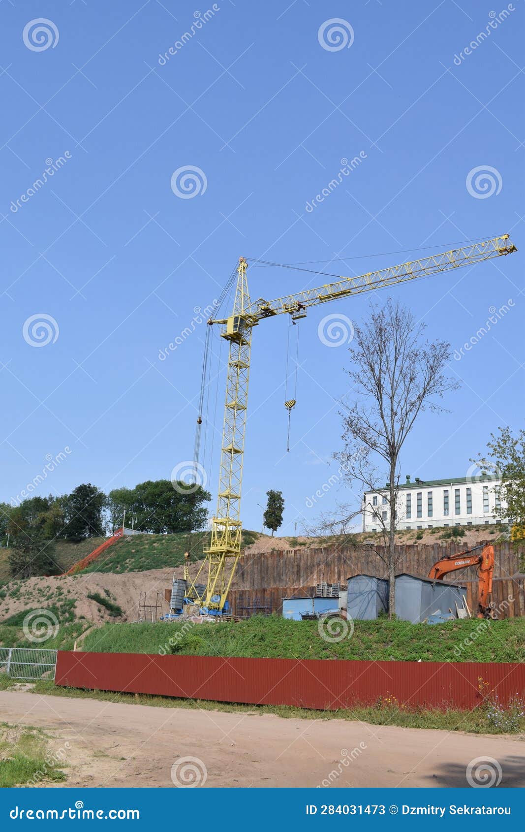 High Tower Crane at a Construction Site Stock Image - Image of crane ... High Tower Crane at a Construction Site Stock Image - Image of crane ...