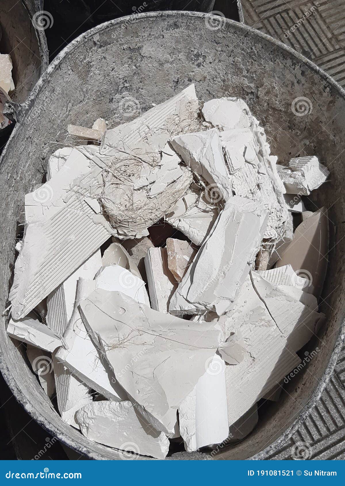 Aerial View of Broken Pieces of Plaster Inside a Bucket or Bricklayer`s ...