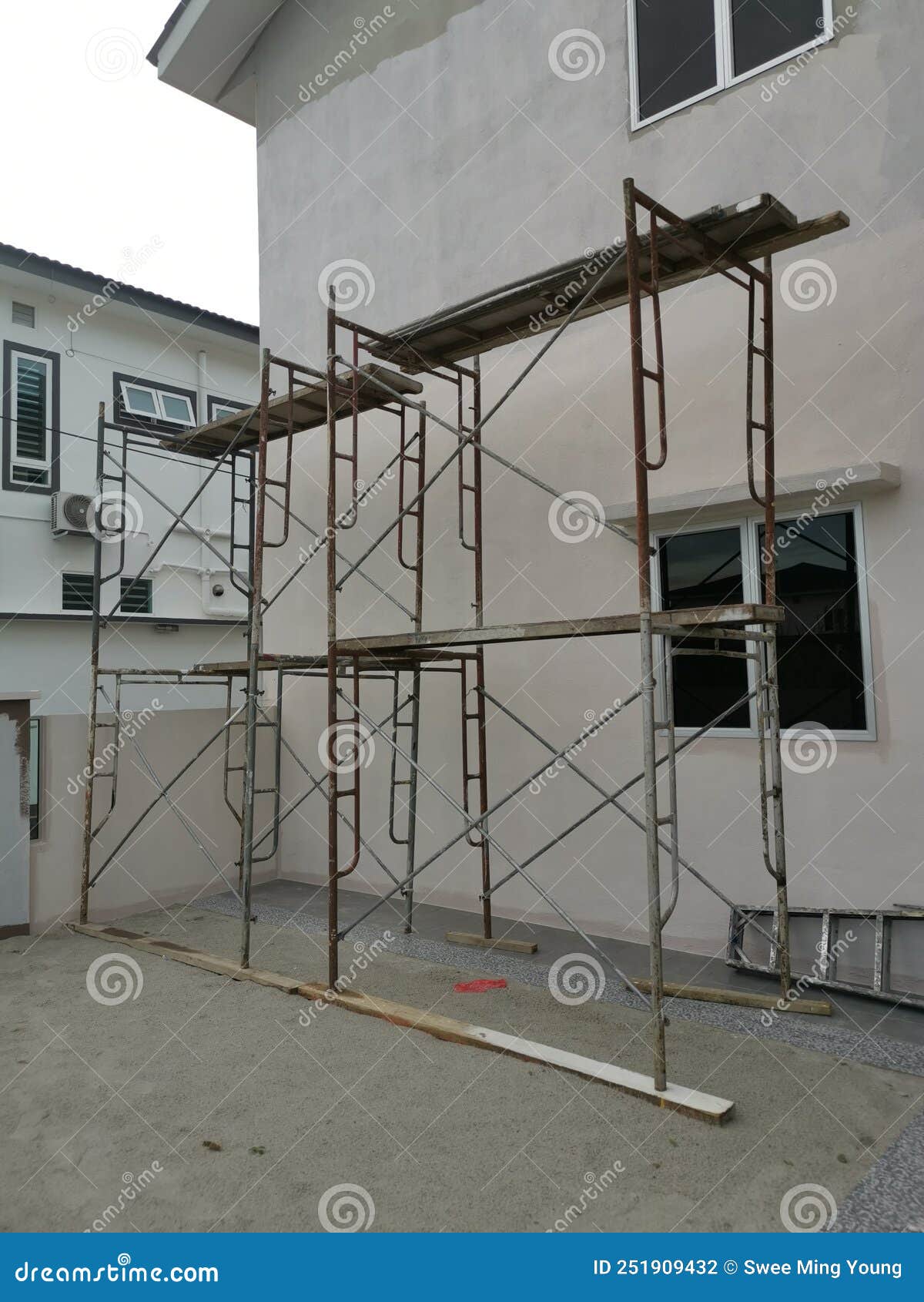 CONSTRUCTION SCAFFOLD Ladder Stacked Outside the Concrete Home Stock ...