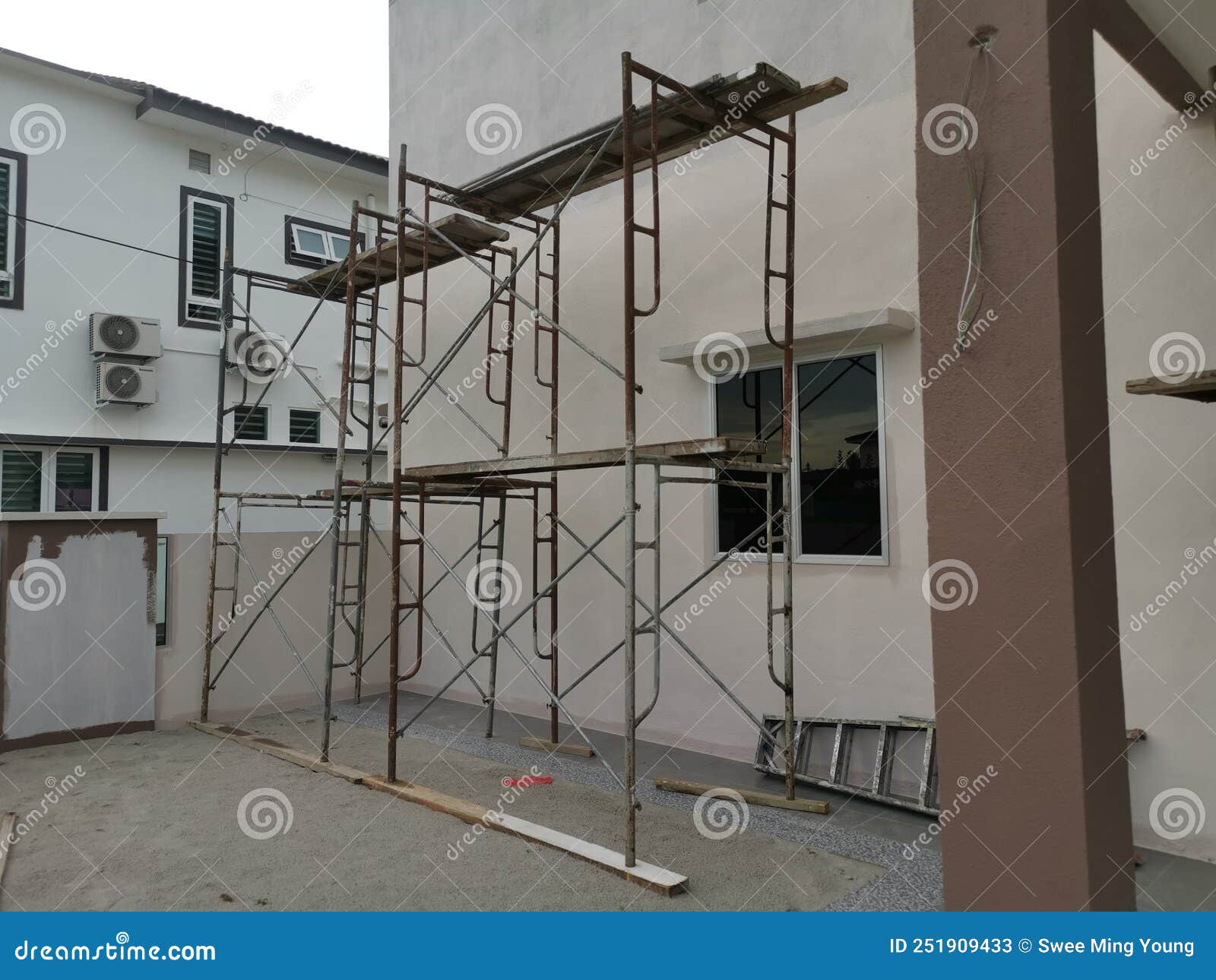 CONSTRUCTION SCAFFOLD Ladder Stacked Outside the Concrete Home Stock ...