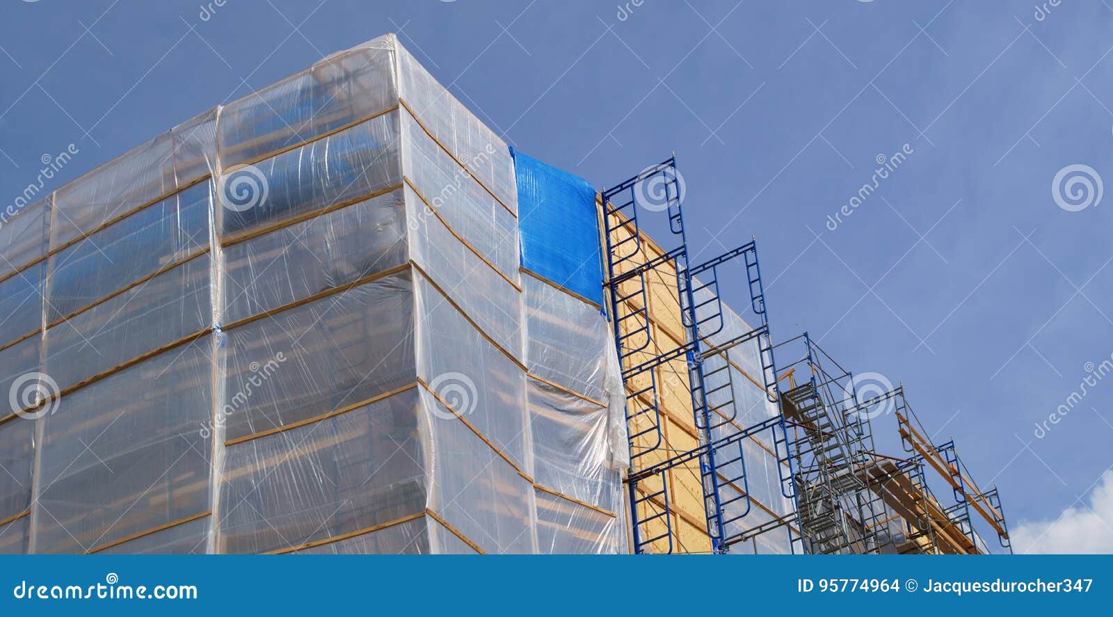 Scaffold Plastic Sheeting Covering A Facade Under Refurbishment, A ...