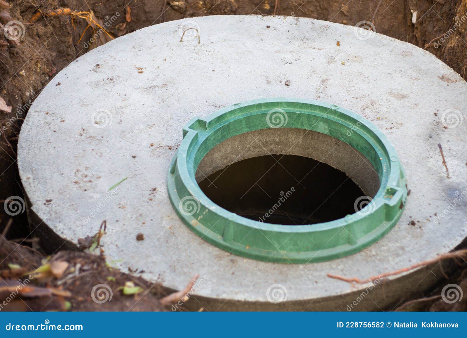 Construction of a Septic Tank. Large Concrete Rings Embedded in the ...