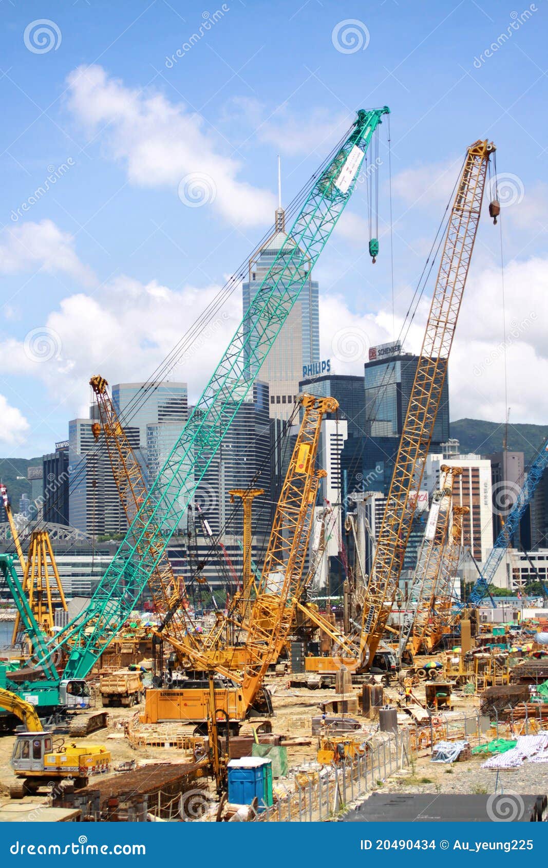 Construction Site, Workers Are Loading And Unloading Building Materials ...