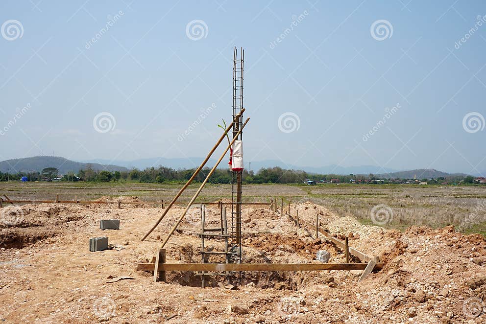 Setting Up the Main Pillar on the Construction Site. Steel Reinforced ...