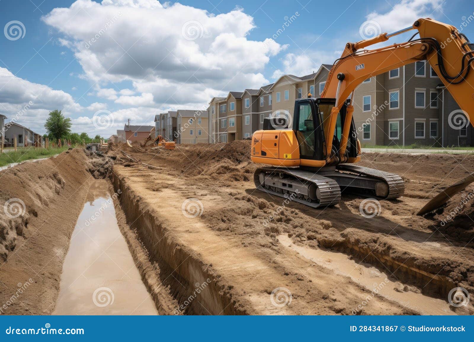 Construction Site with Backhoe Digging Ditch To Lay Pipeline Stock ...