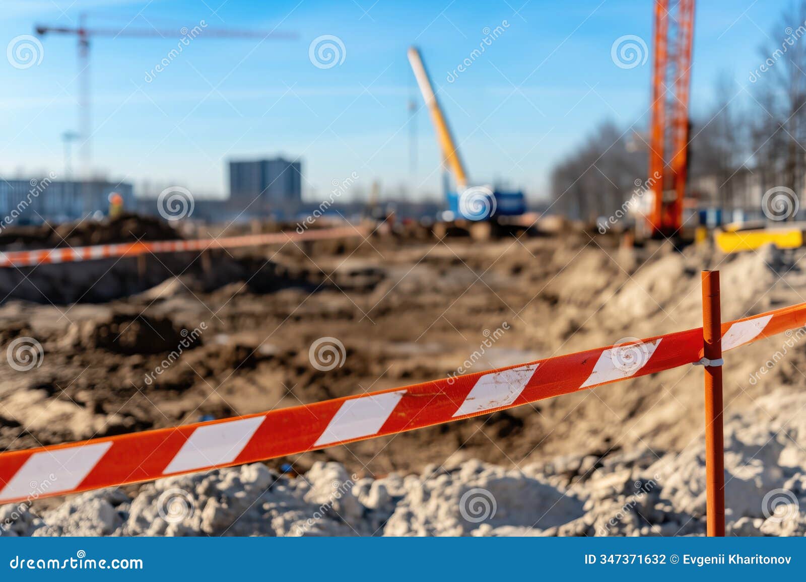 Construction Site with Barrier Tape Close Up on a Foreground and Crane on Background Stock ...