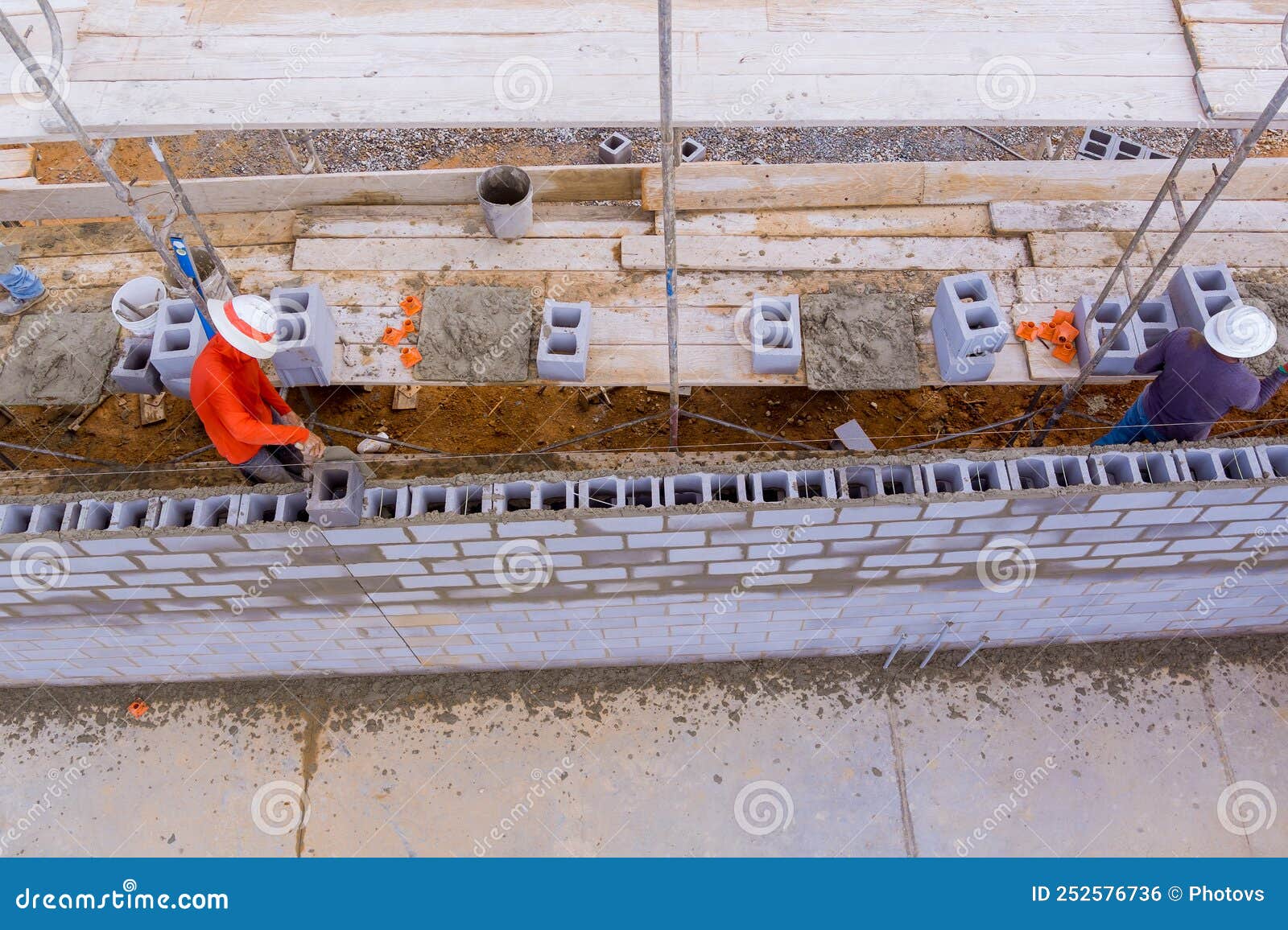 The Construction Site is Being Worked on by Workers Who are Laying ...