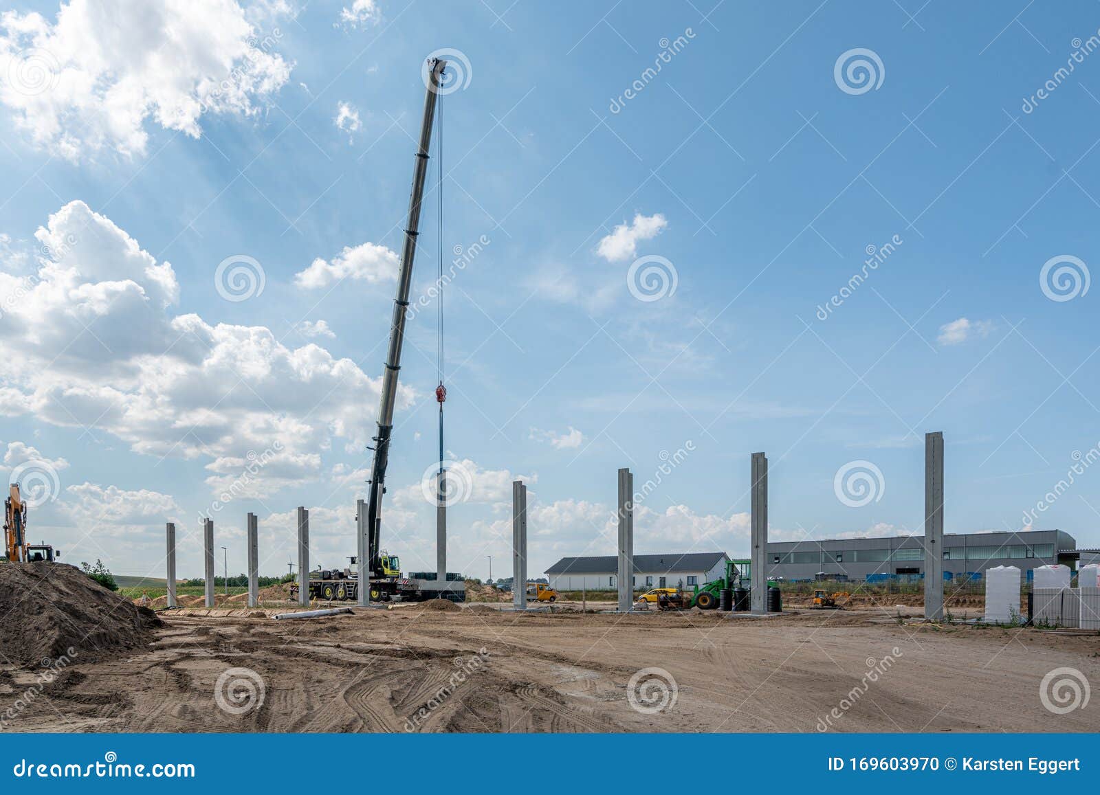 A Construction Site, Concrete Columns for a Factory Building are Placed ...