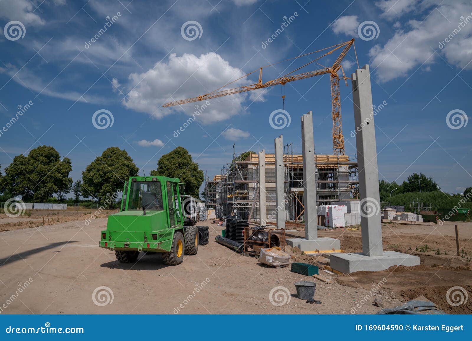 A Construction Site, Concrete Columns for a Factory Building are Placed ...