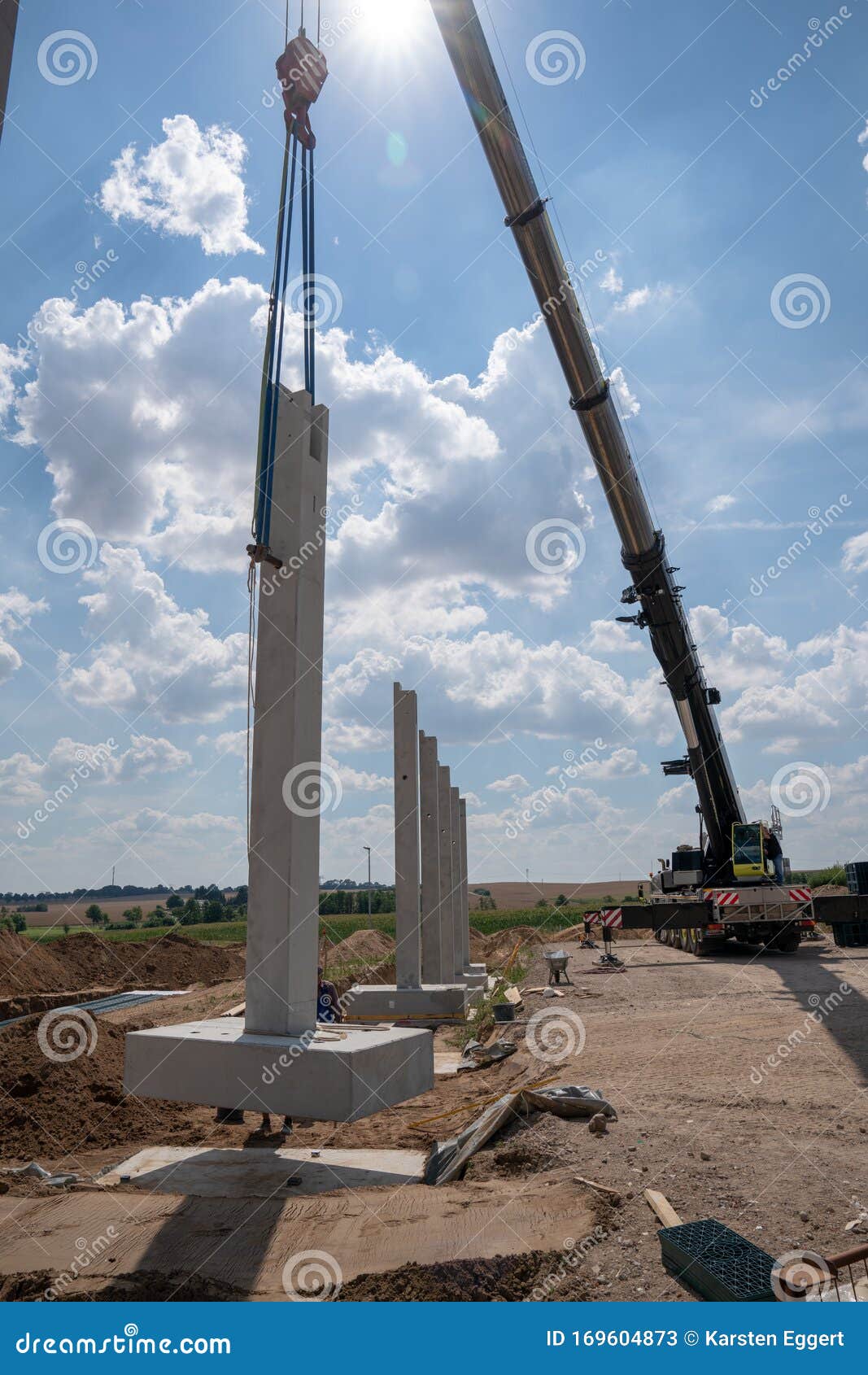 A Construction Site, Concrete Columns for a Factory Building are Placed ...