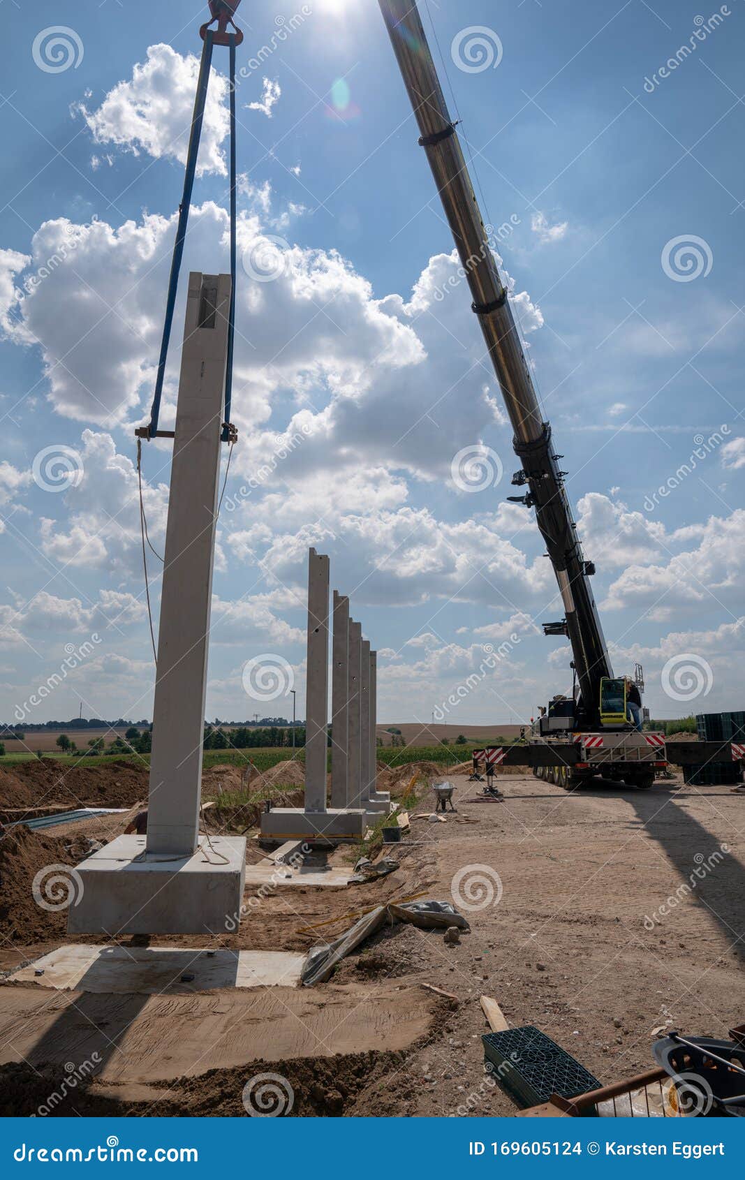 A Construction Site, Concrete Columns for a Factory Building are Placed ...