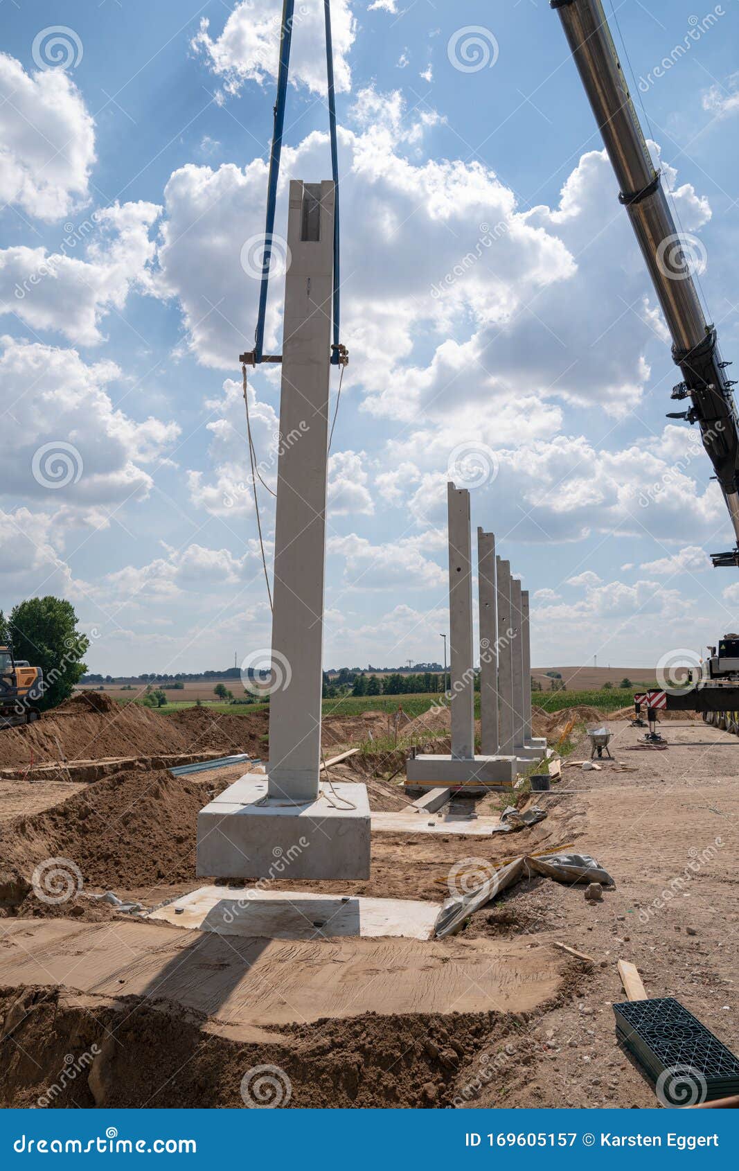 A Construction Site, Concrete Columns for a Factory Building are Placed ...